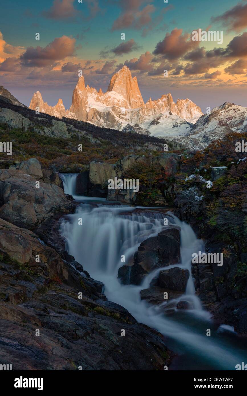 Mount Fitz Roy and waterfall at sunrise in Autumn, El Chalten ...