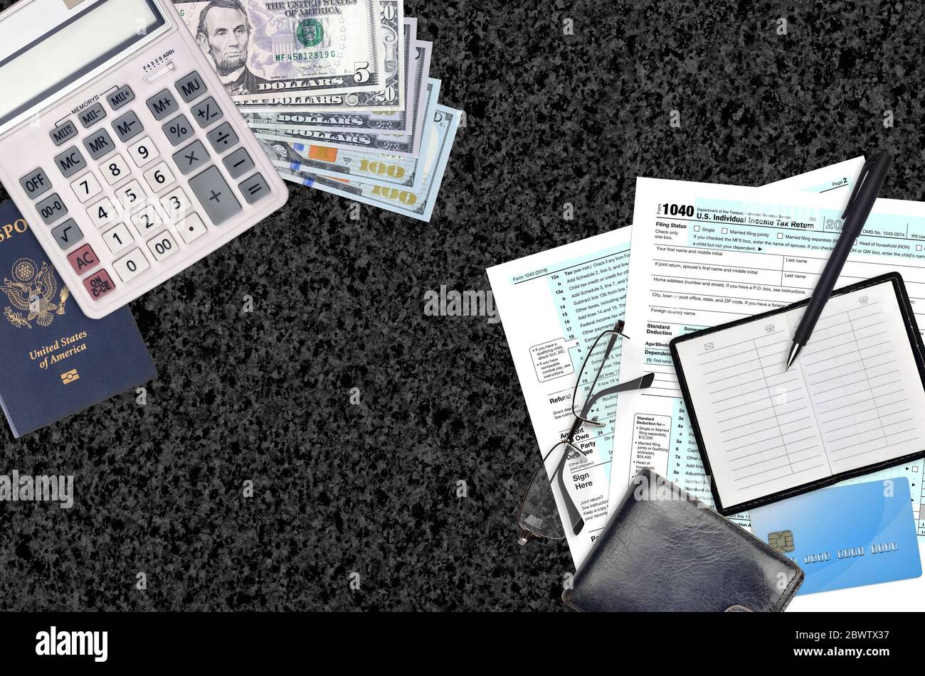 IRS form 1040 Individual income tax return lies on flat lay office ...