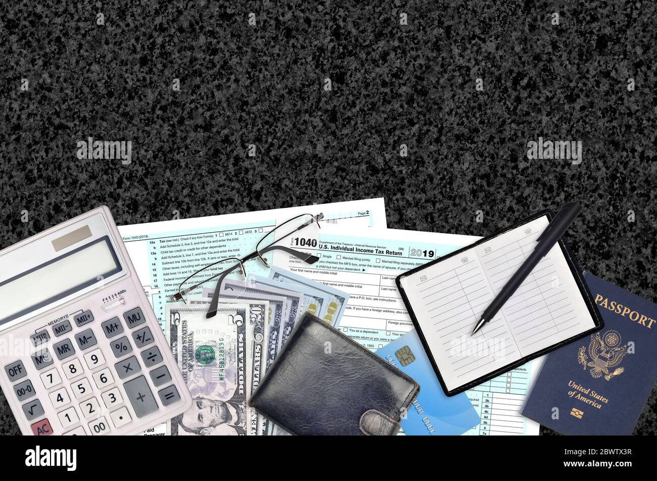 IRS form 1040 Individual income tax return lies on flat lay office ...