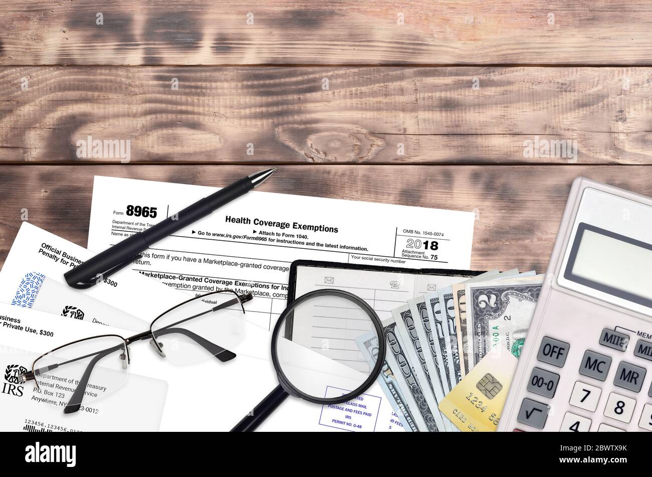 IRS form 8965 Health Coverage Exemptions lies on flat lay office table ...