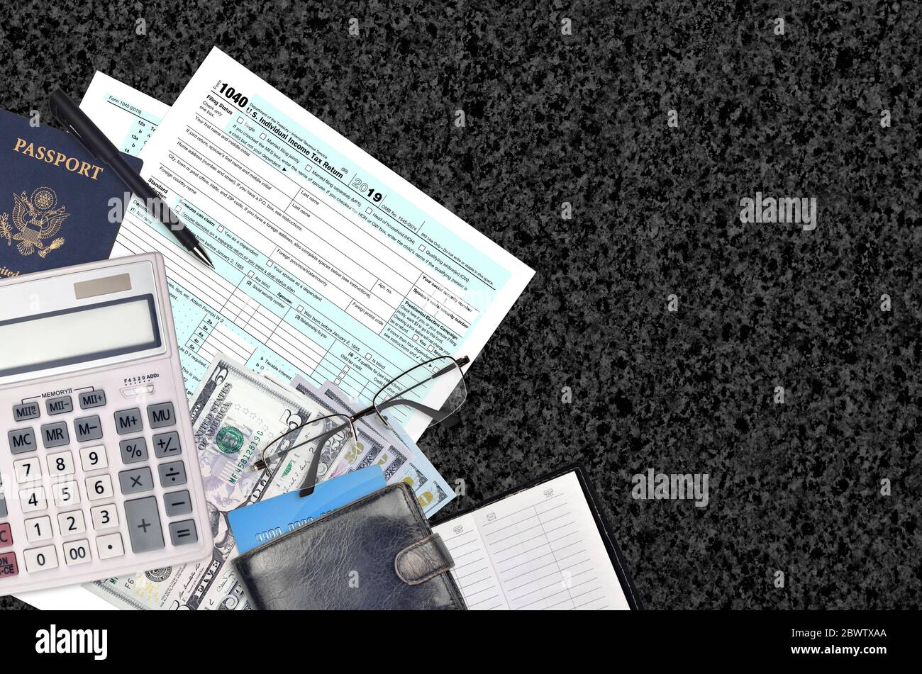 IRS form 1040 Individual income tax return lies on flat lay office ...