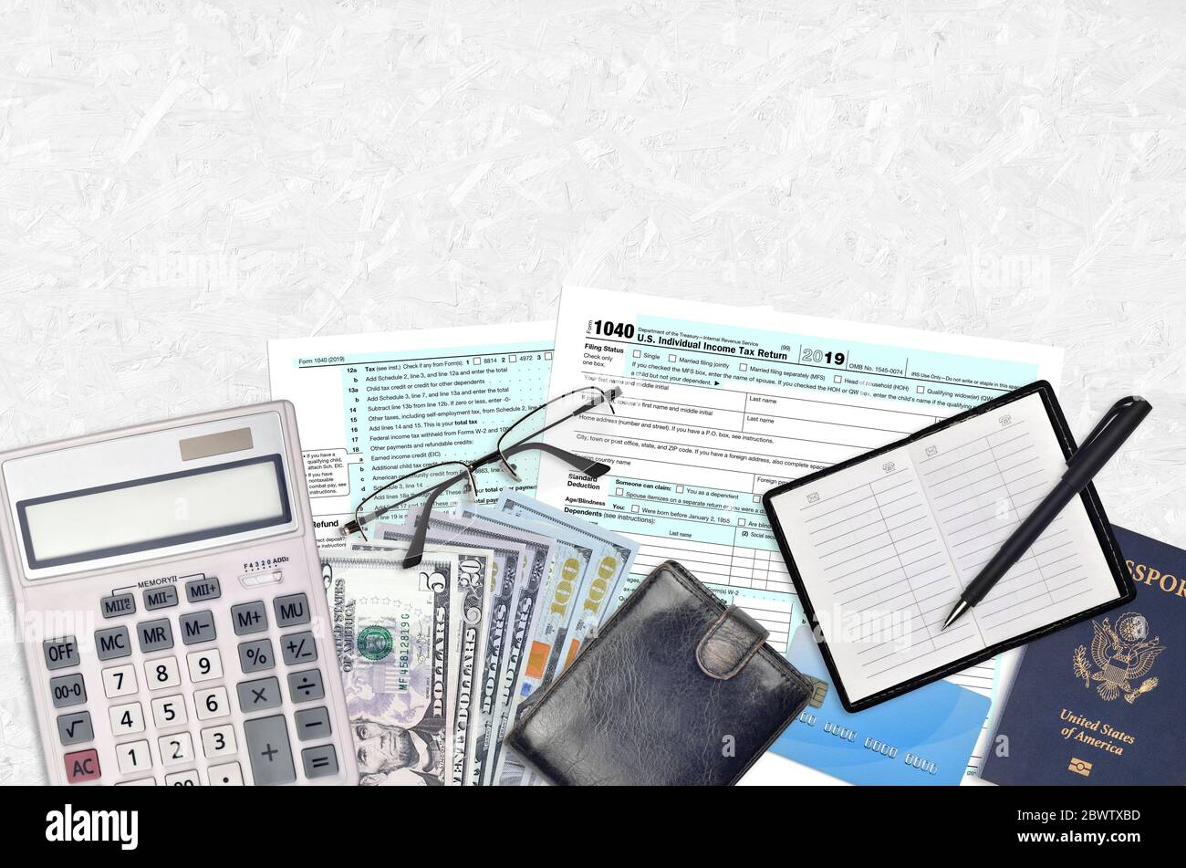 IRS form 1040 Individual income tax return lies on flat lay office ...