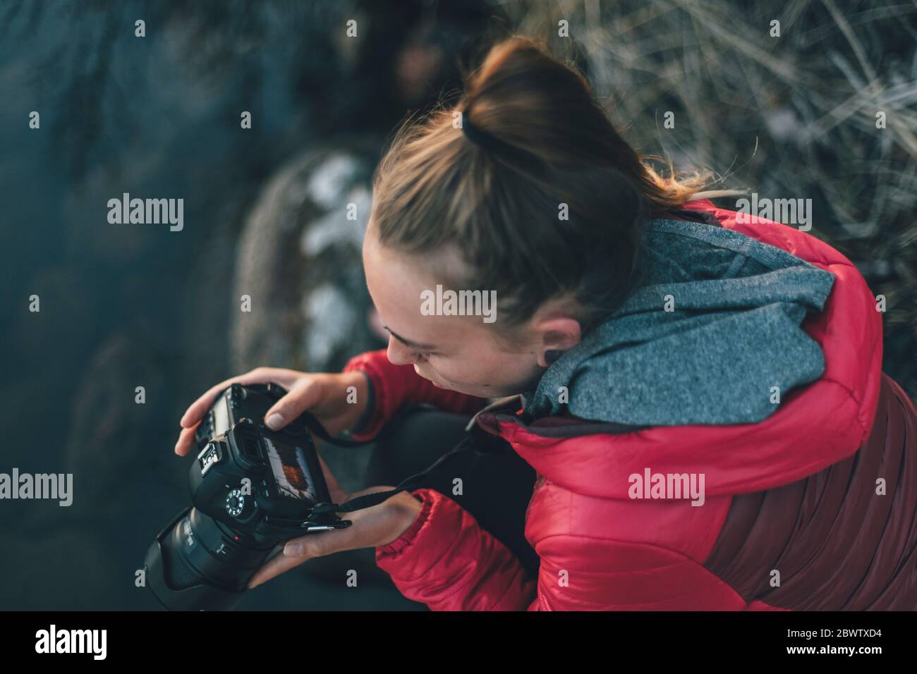 Female photographer using on camera hi-res stock photography and images ...