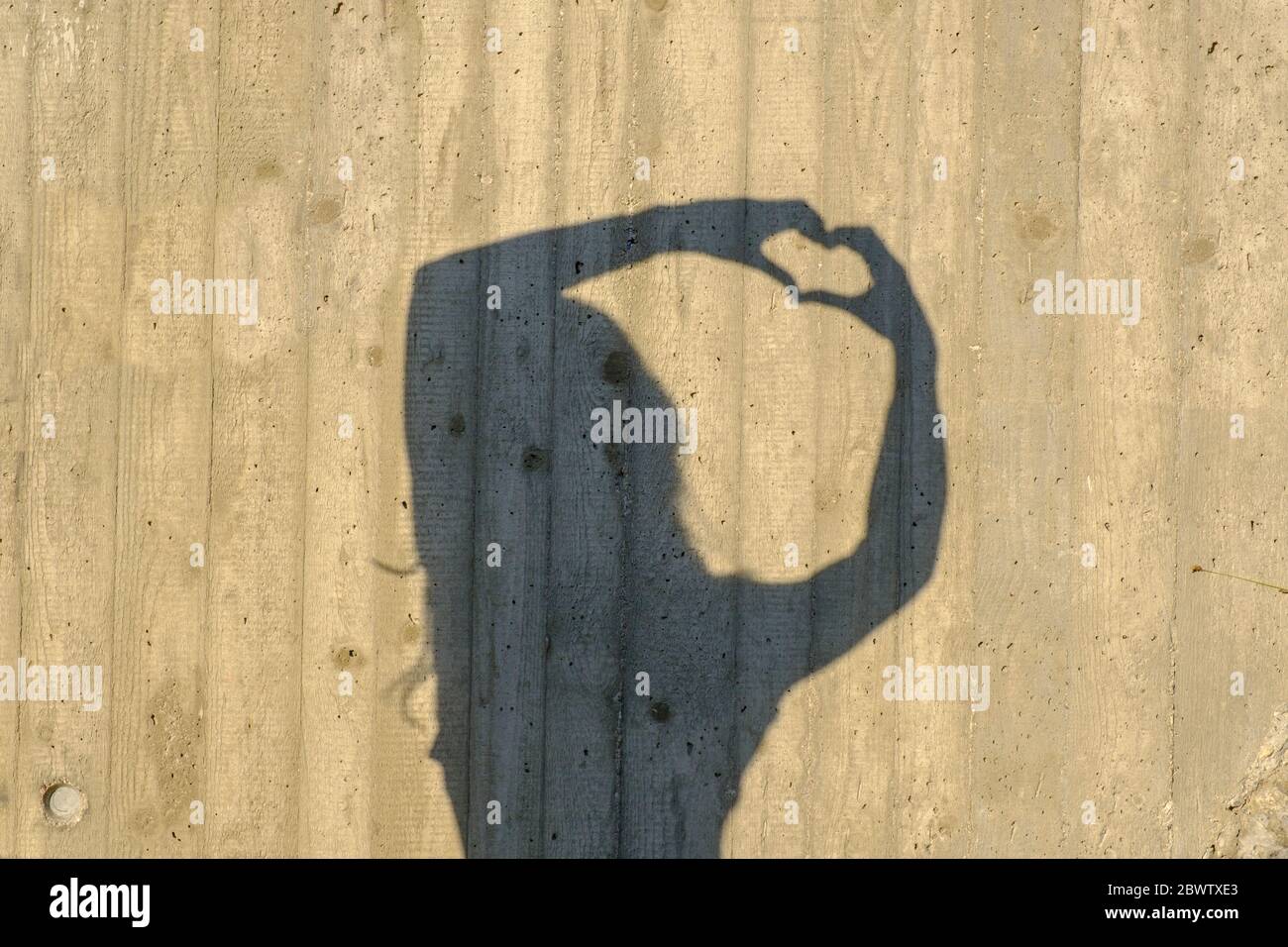 Shadow of teenage girl forming heart with hands Stock Photo - Alamy