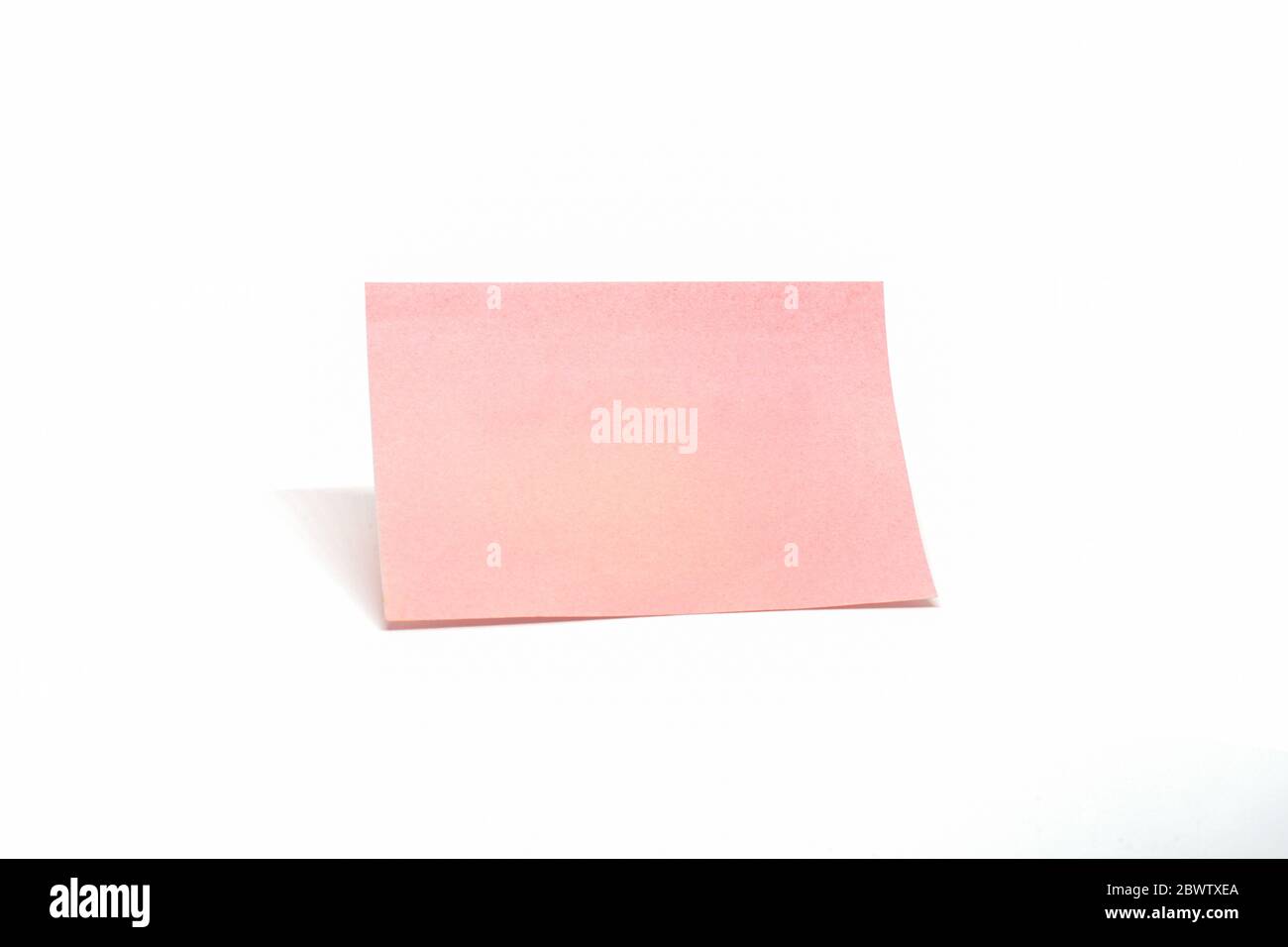 Isolated Single pink notepad paper on white background Stock Photo - Alamy