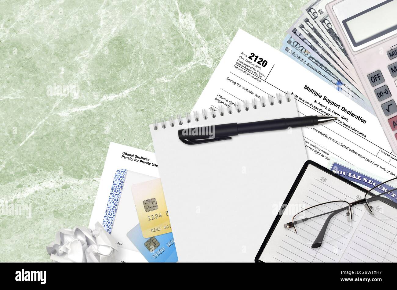 IRS form 2120 Multiple support declaration lies on flat lay office ...