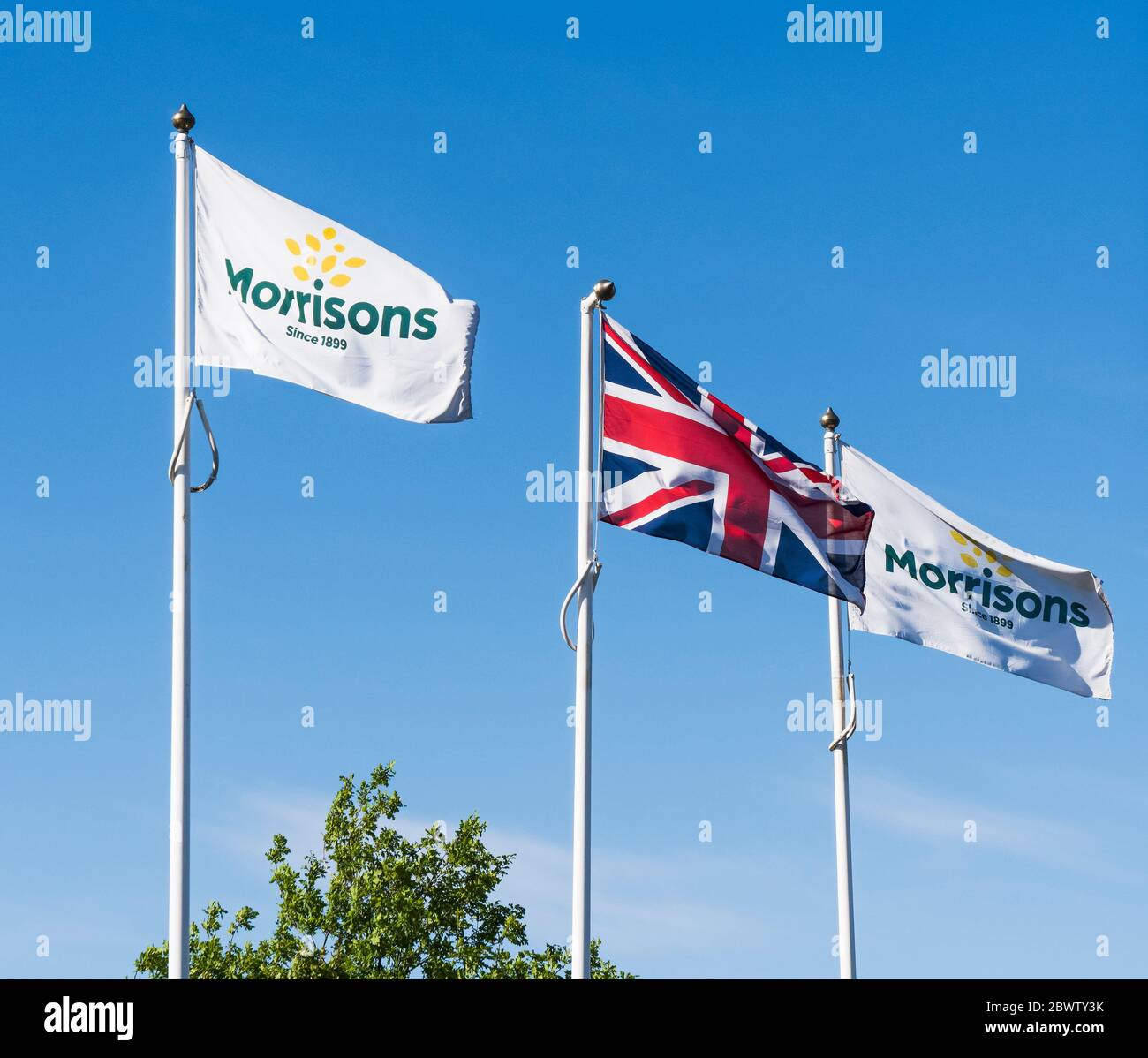 Flags outside a Morrisons Uk supermarket with a Union Jack Stock Photo ...