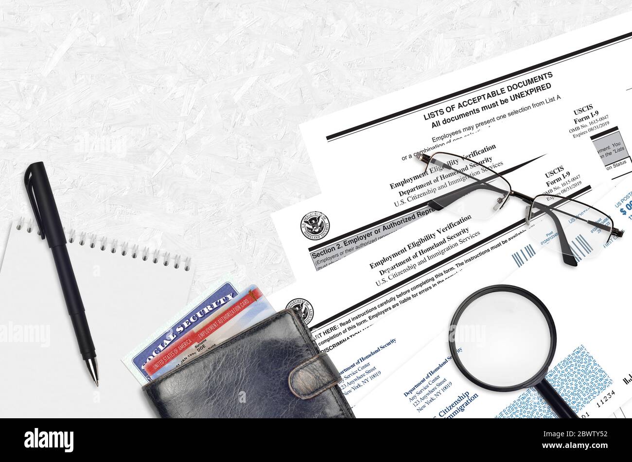 USCIS form I-9 Employment eligibility verification lies on flat lay ...