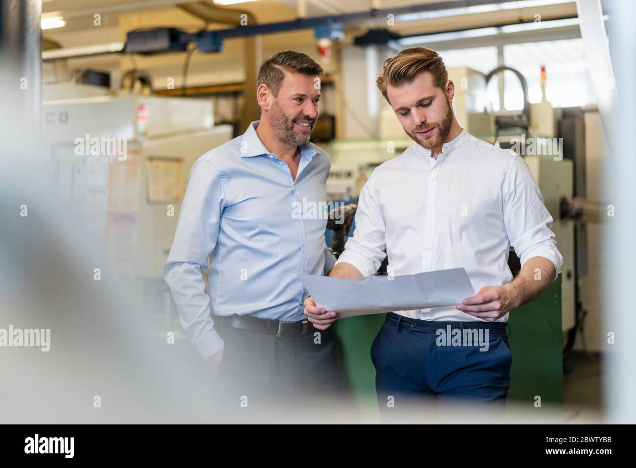 Two men discussing plan hi-res stock photography and images - Alamy