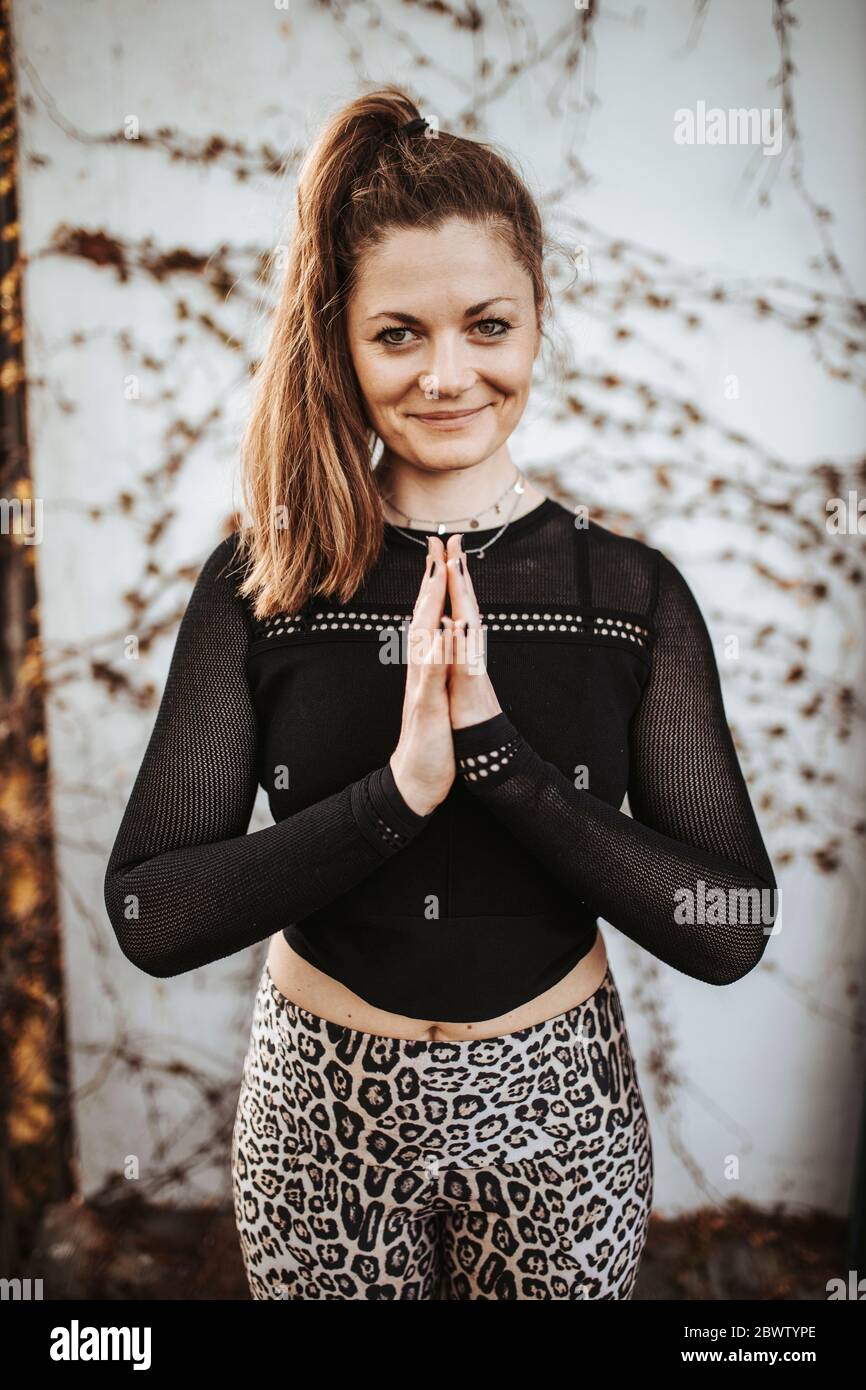 Woman with hands at prayer position Stock Photo - Alamy