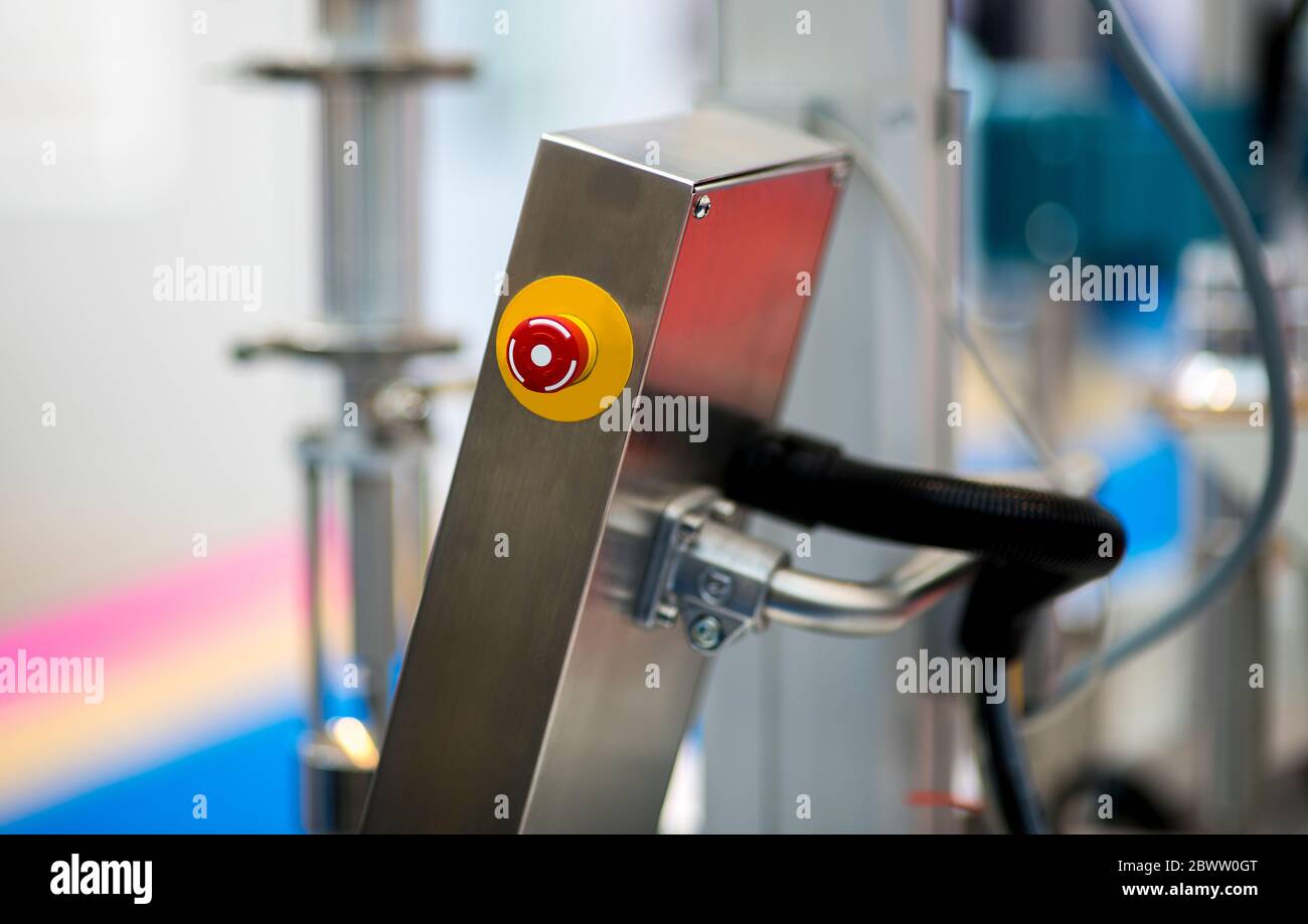 The red emergency button or stop button for Hand press. STOP Button for ...