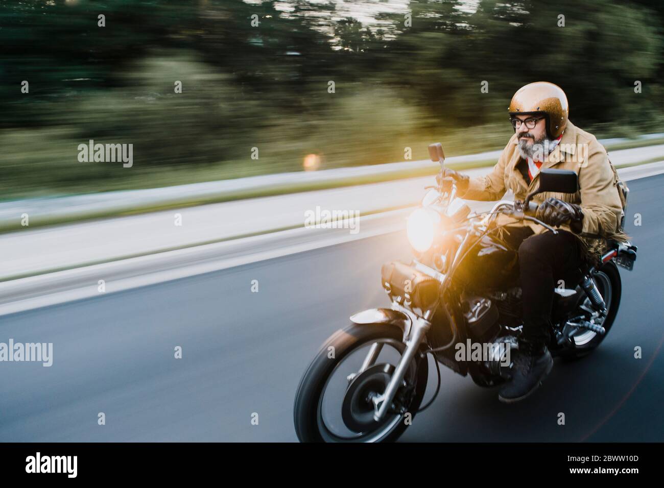Portrait of man riding motorbike Stock Photo - Alamy