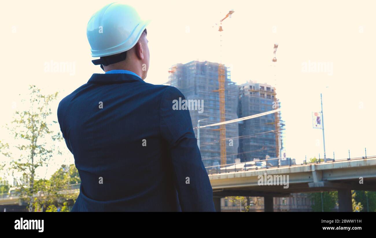 Portrait of a successful young handsome engineer, architect, builder ...