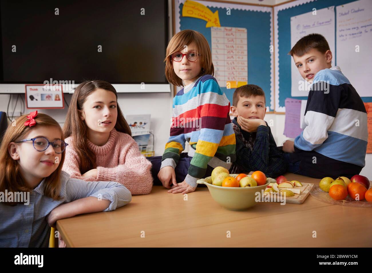 Portrait of five children in a classroom during break time Stock Photo ...
