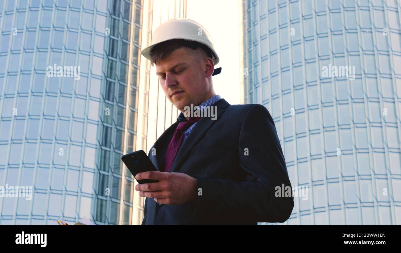 Portrait of a successful young handsome engineer, architect, builder ...