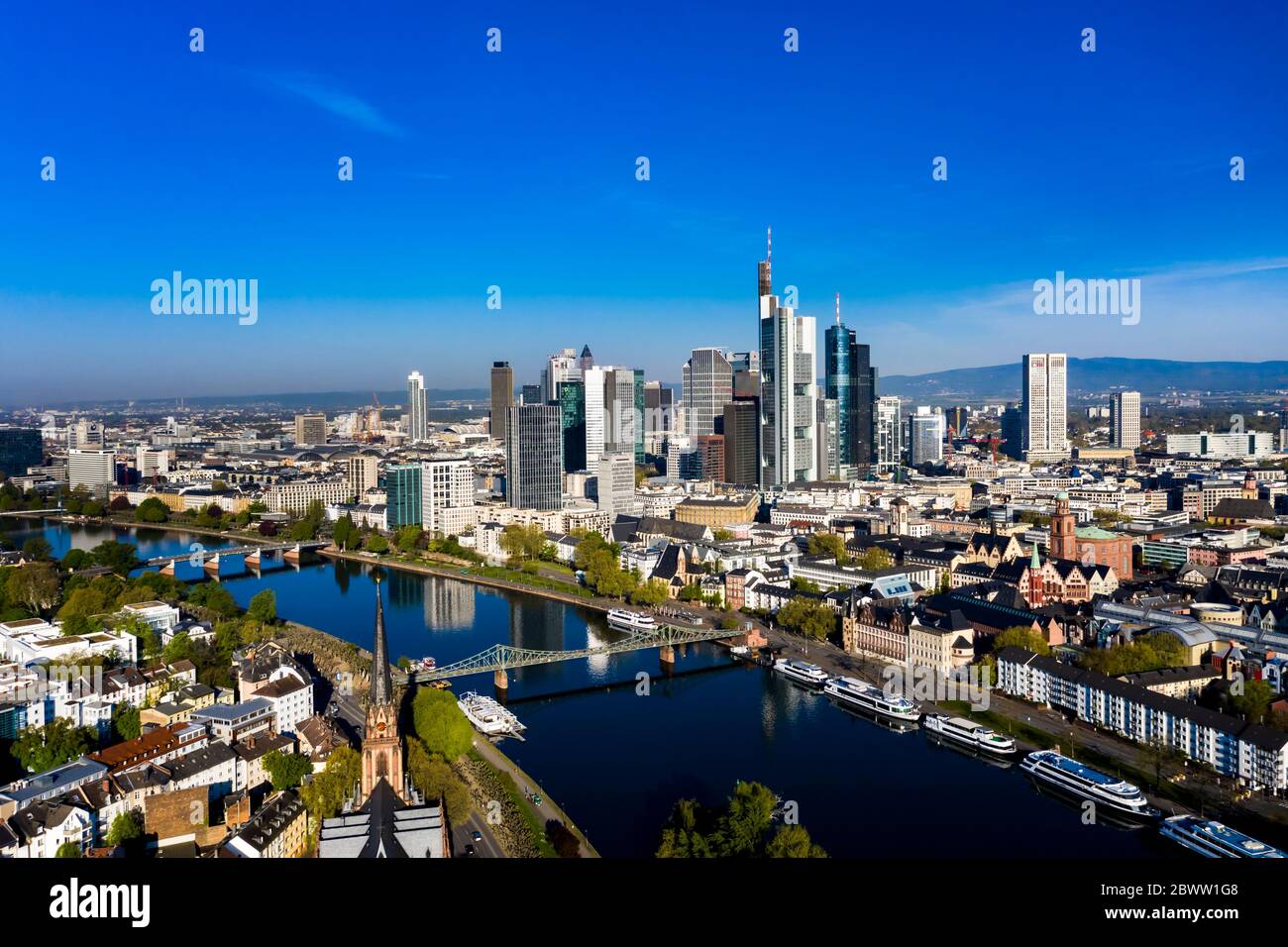 Germany, Hesse, Frankfurt, Helicopter view of riverside city with ...