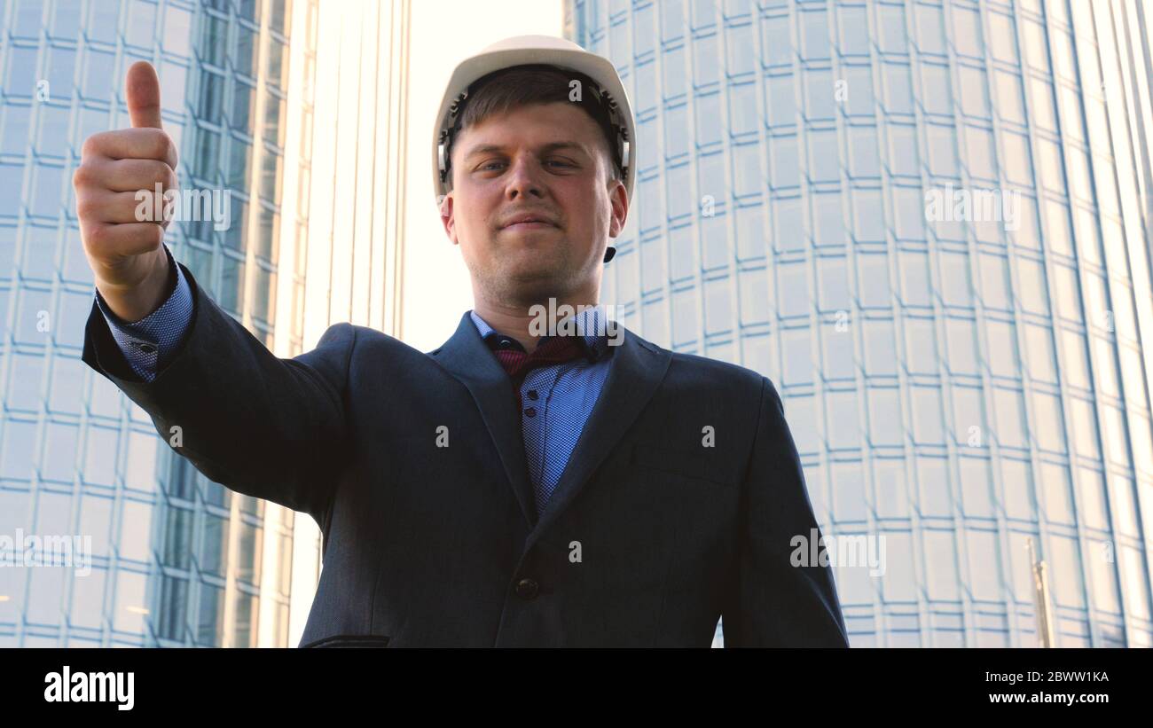 Portrait of a successful young handsome engineer, architect, builder ...