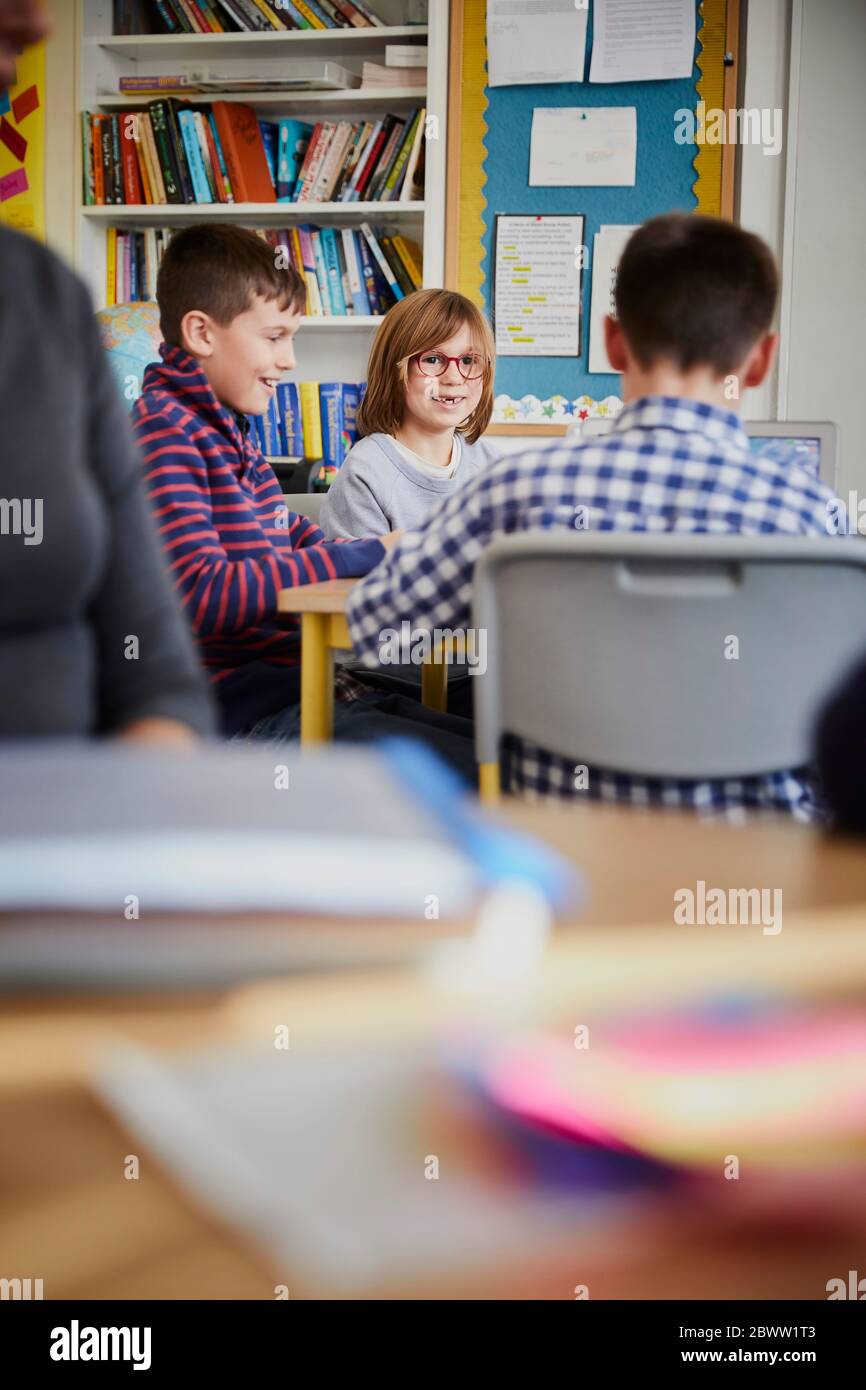 Group of children in a classroom during a lesson interacting Stock ...