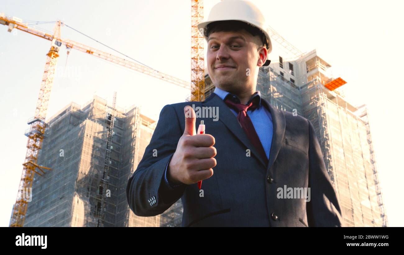 Portrait of a successful young handsome engineer, architect, builder ...