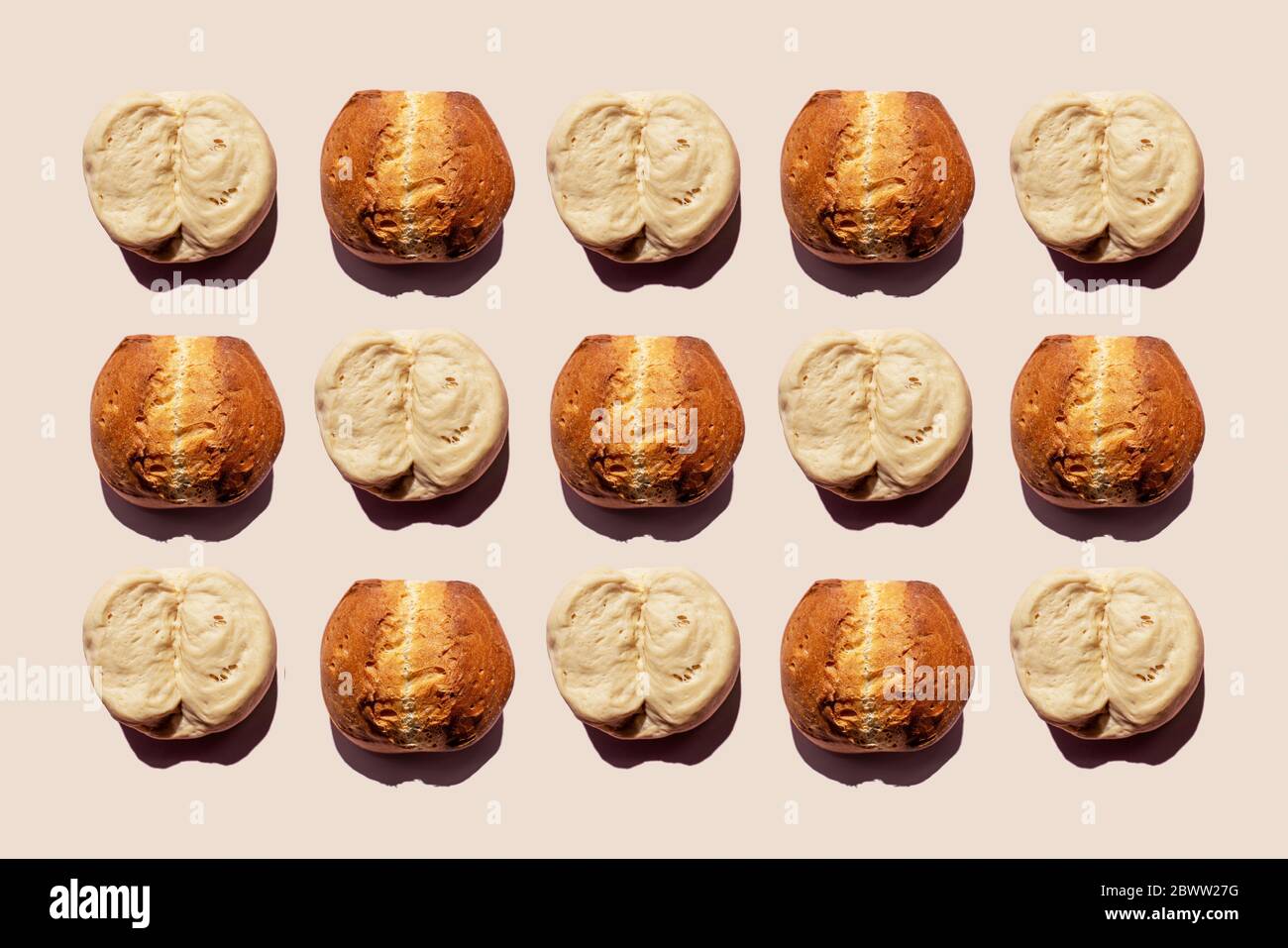 Pattern of rows of raw dough lumps and baked breads Stock Photo - Alamy