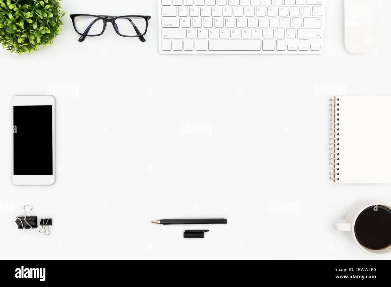 White hipster office desk table with computer gadgets, and supplies ...