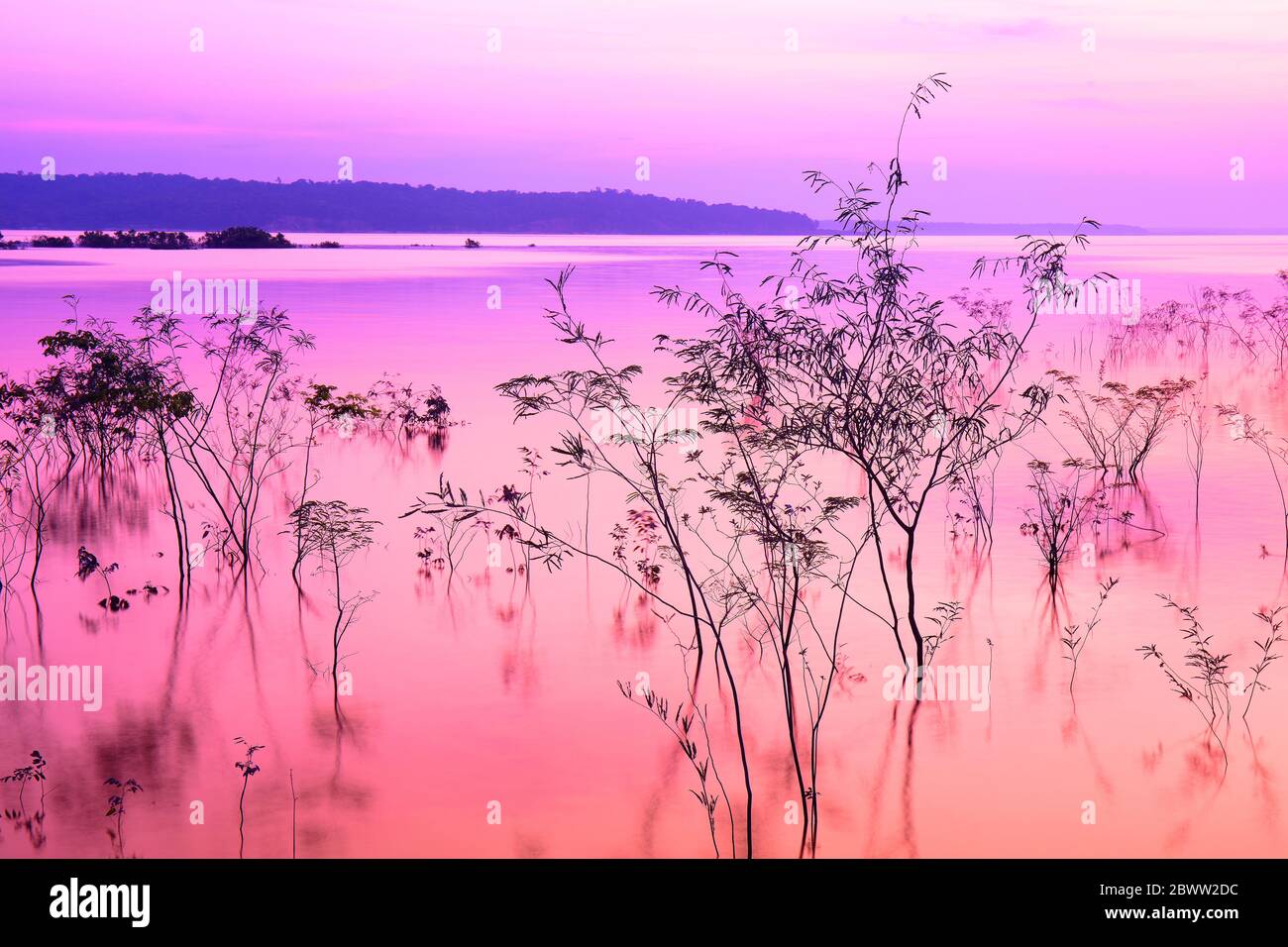 Fantastic sunset with the sun setting over the horizon in the Amazon ...