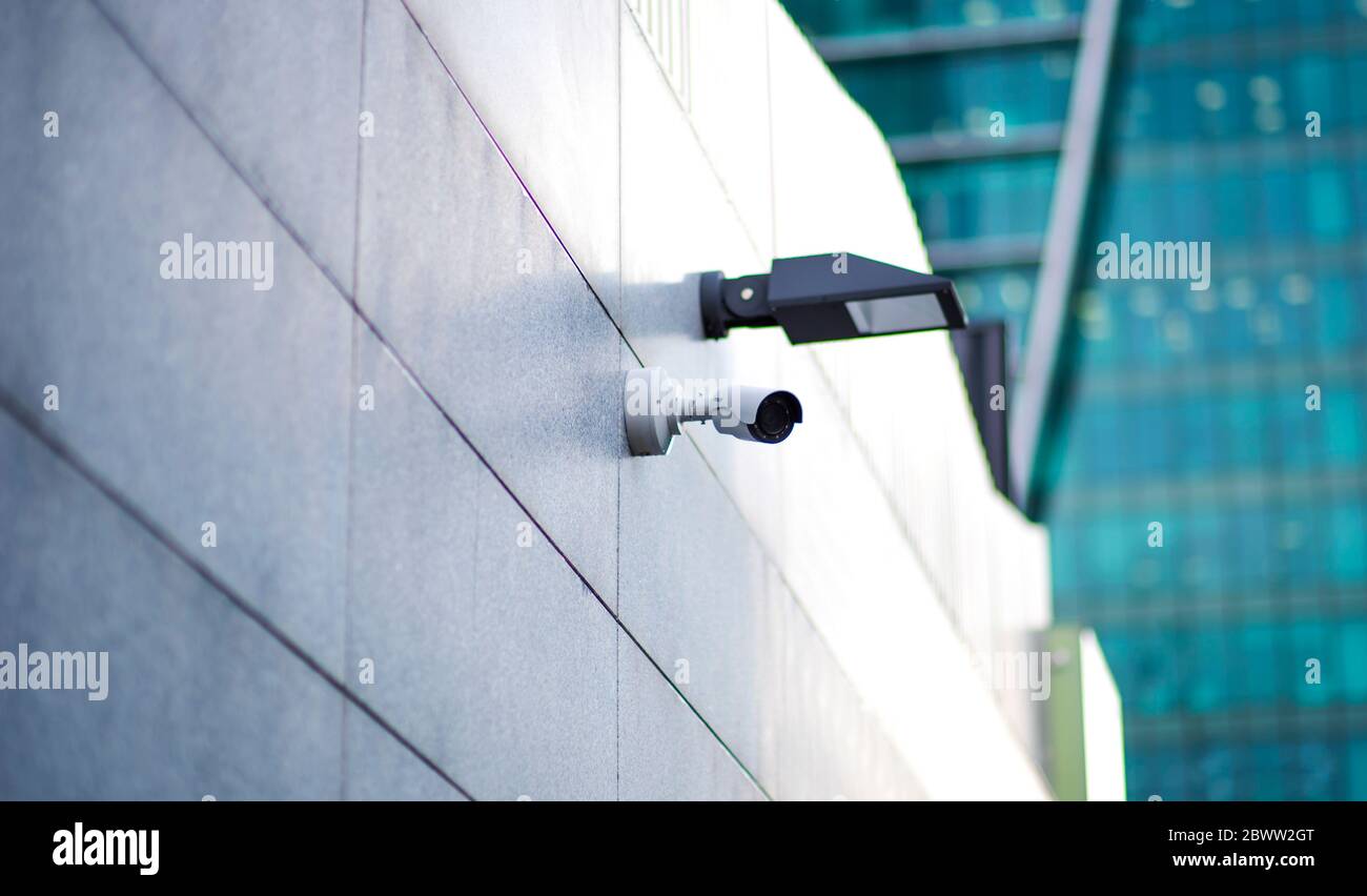three cctv security cameras on the street pylon Stock Photo - Alamy