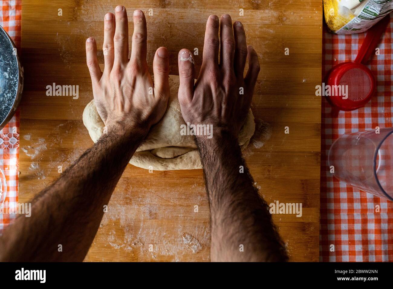 Mans hands kneading dough hi-res stock photography and images - Alamy