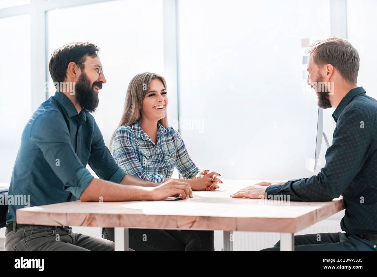 business team discussing current tasks at the desktop Stock Photo - Alamy