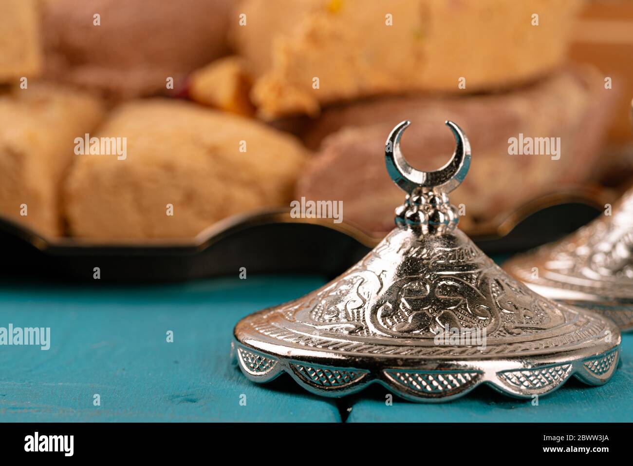 Turkish delight dessert on traditional tableware on dark blue table ...