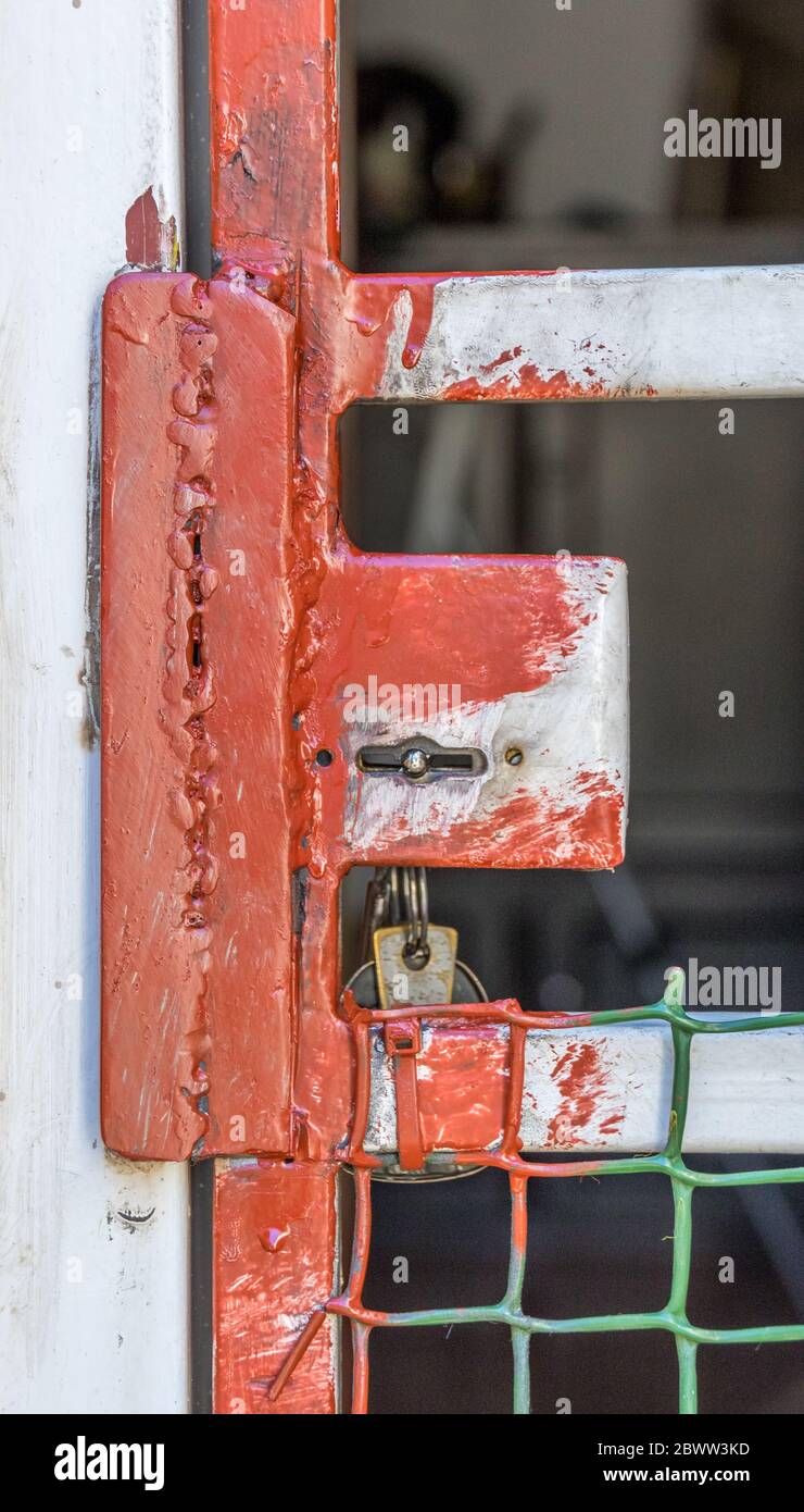 Repairs to a metal security gate painted with red oxide primer image in ...