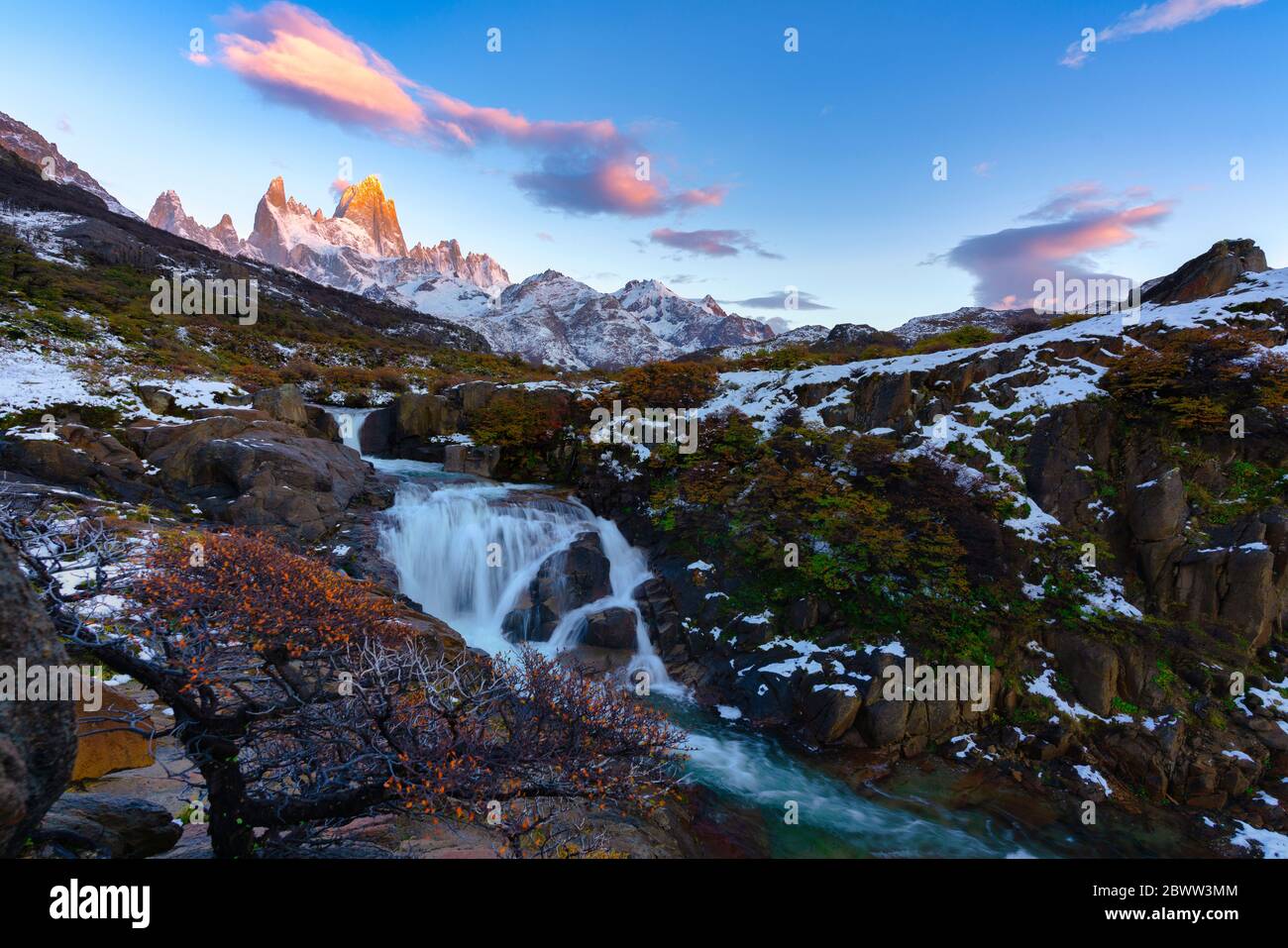 Mount Fitz Roy and waterfall at sunrise in Autumn, El Chalten ...