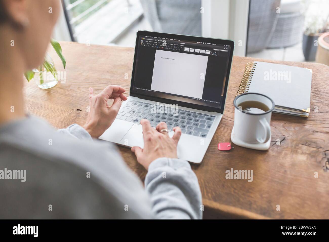 Mature woman working from home, using laptop Stock Photo - Alamy
