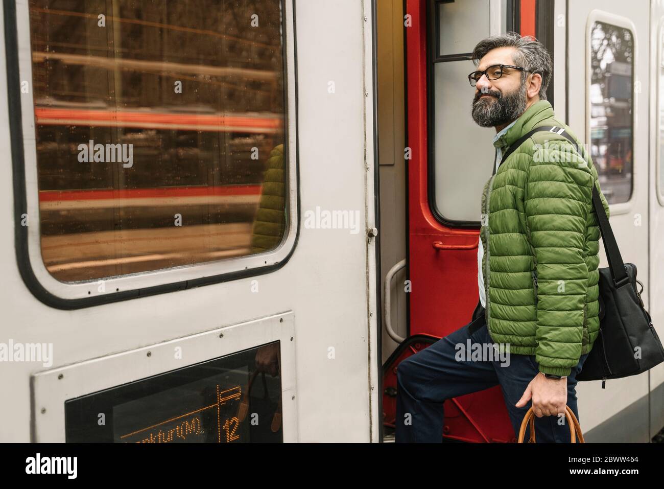 Man entering train hi-res stock photography and images - Alamy