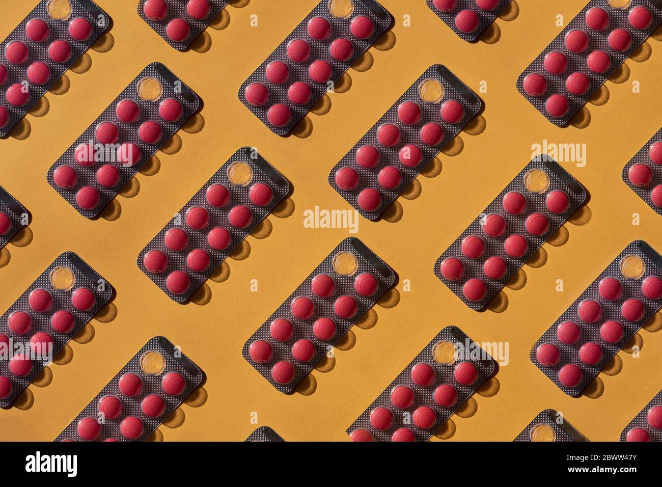Pattern of red pills blister packs Stock Photo - Alamy