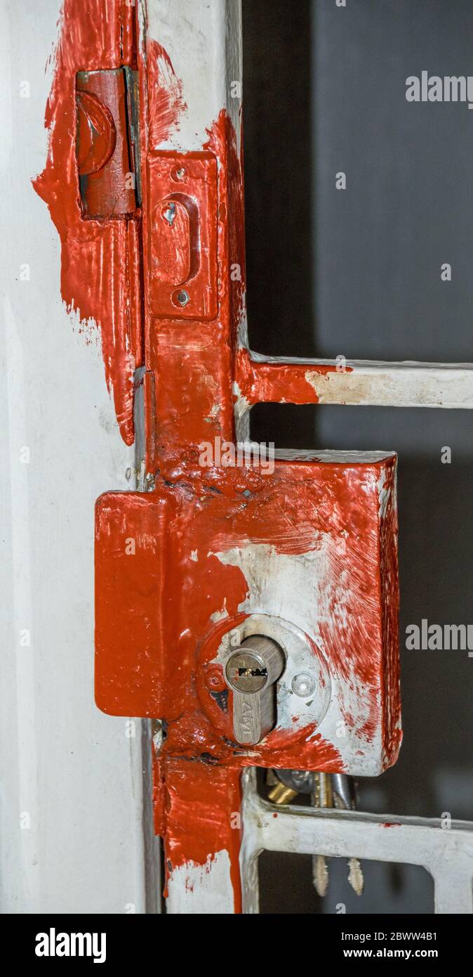 Repairs to a metal security gate painted with red oxide primer image in ...