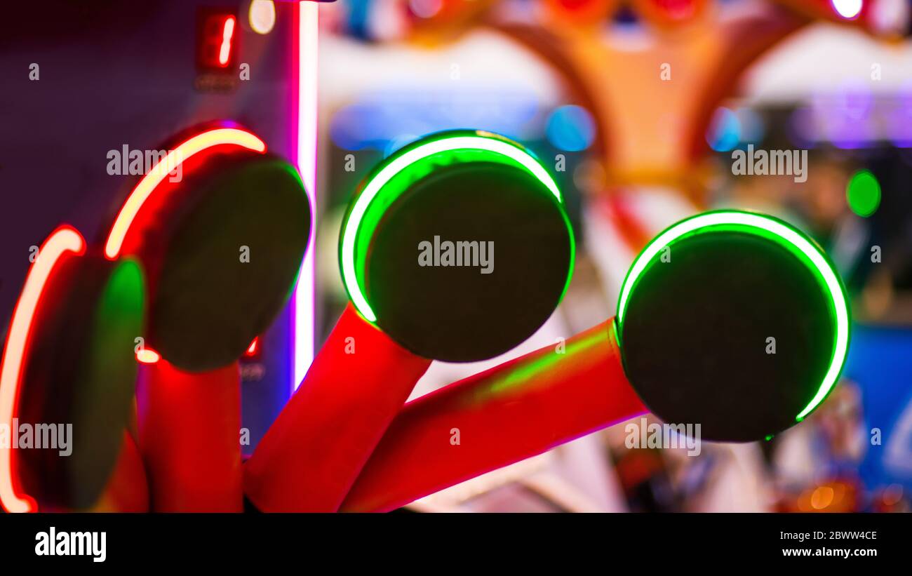 Detail of a joystick and buttons on an old arcade game in a gaming room ...