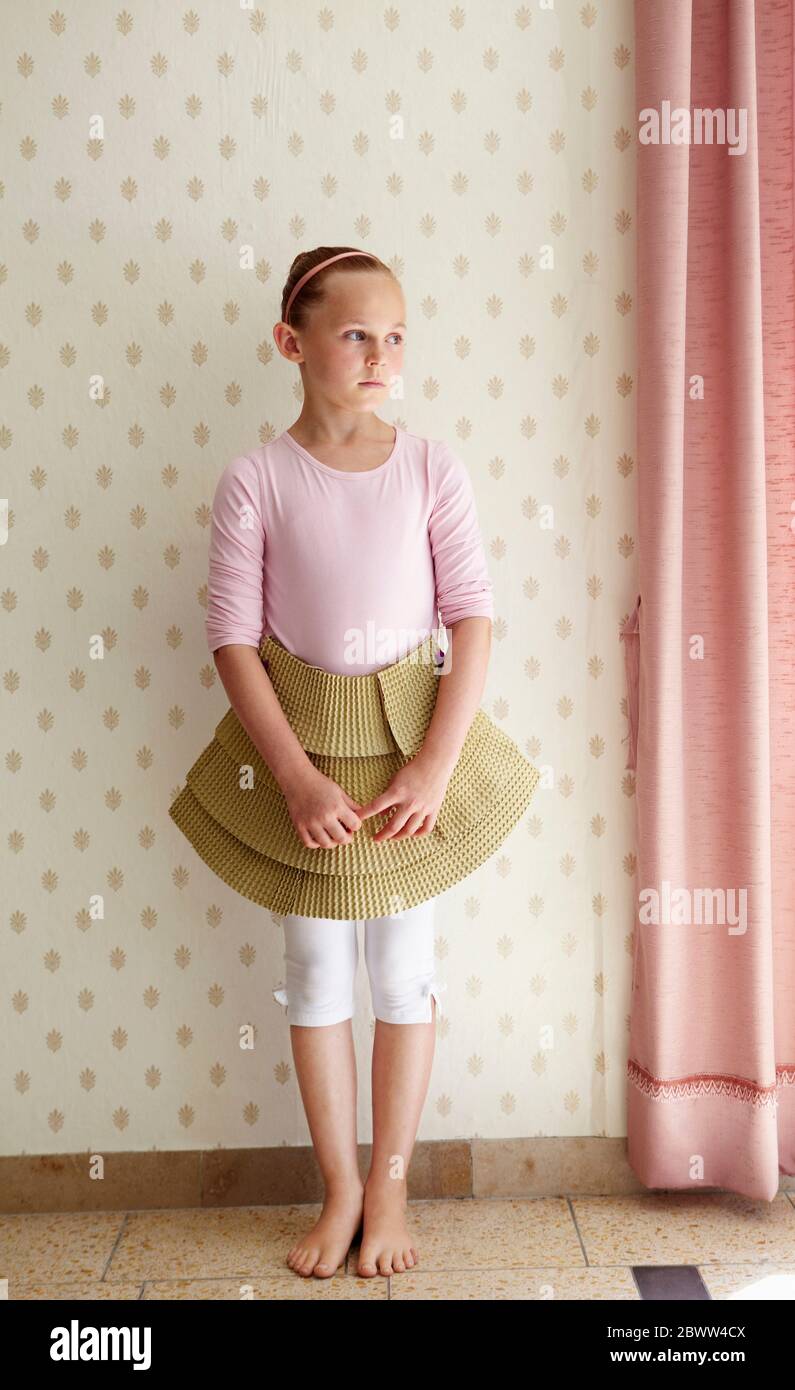 Serious girl wearing cardboard tutu Stock Photo - Alamy