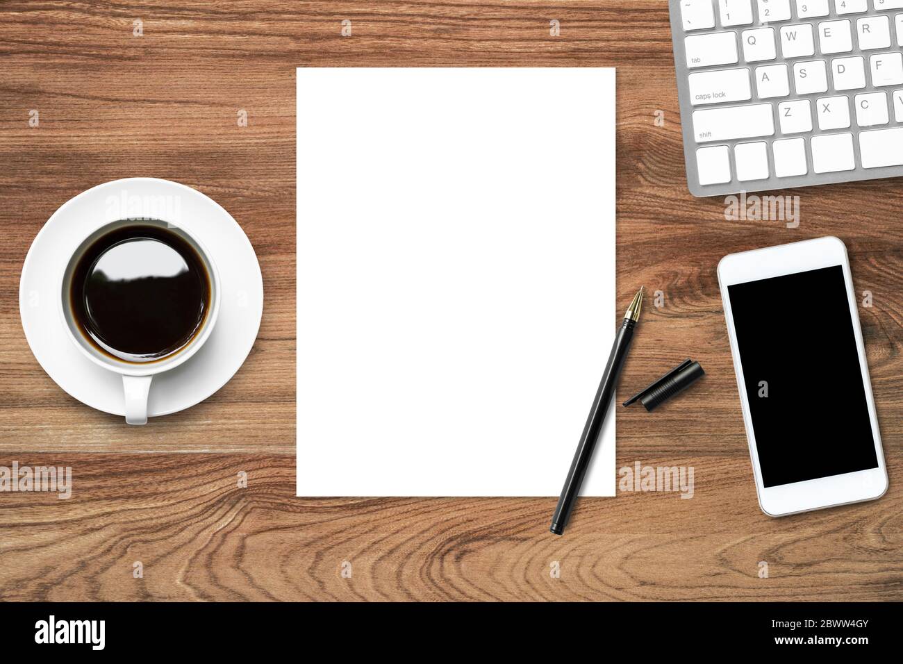 Blank a4 paper with pen are on top of wood table Stock Photo - Alamy