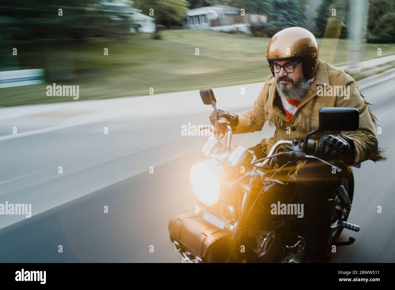 Portrait of man riding motorbike Stock Photo - Alamy