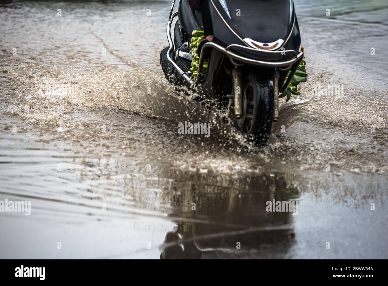 dirty water splash after vehicle roaring by Stock Photo - Alamy