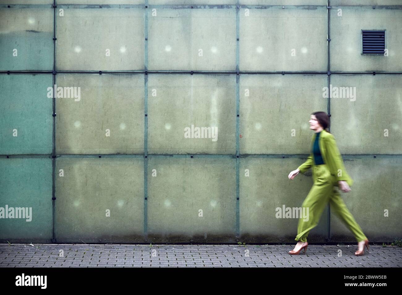 Person passing a wall hi-res stock photography and images - Alamy