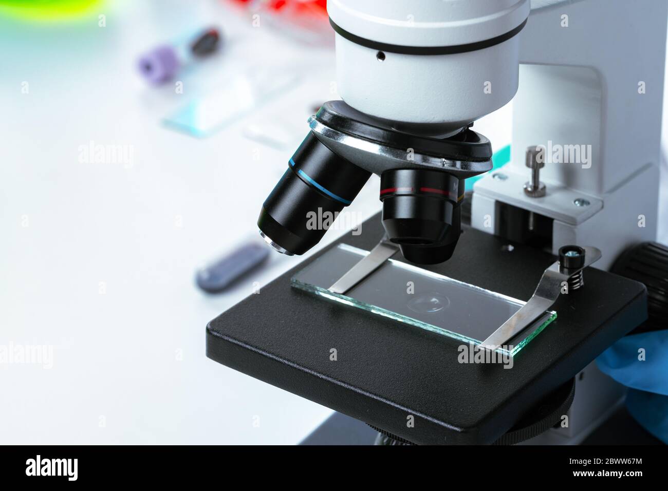 Close up photo of a microscope lenses examining glass sample Stock ...
