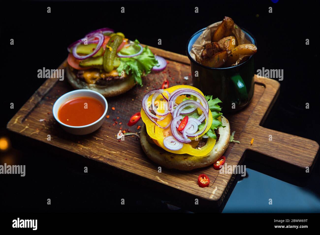 Burger set on a board Stock Photo - Alamy