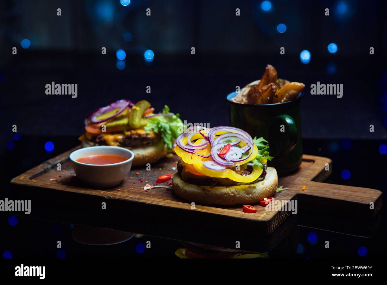Burger set on a board Stock Photo - Alamy