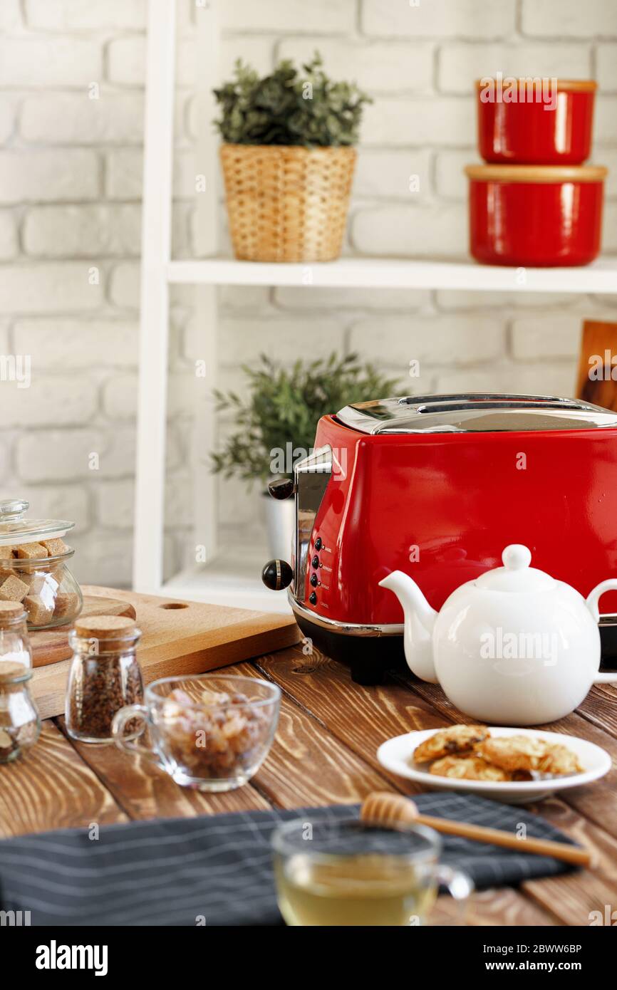 Ceramic teapot and toaster, kitchen table close up Stock Photo - Alamy