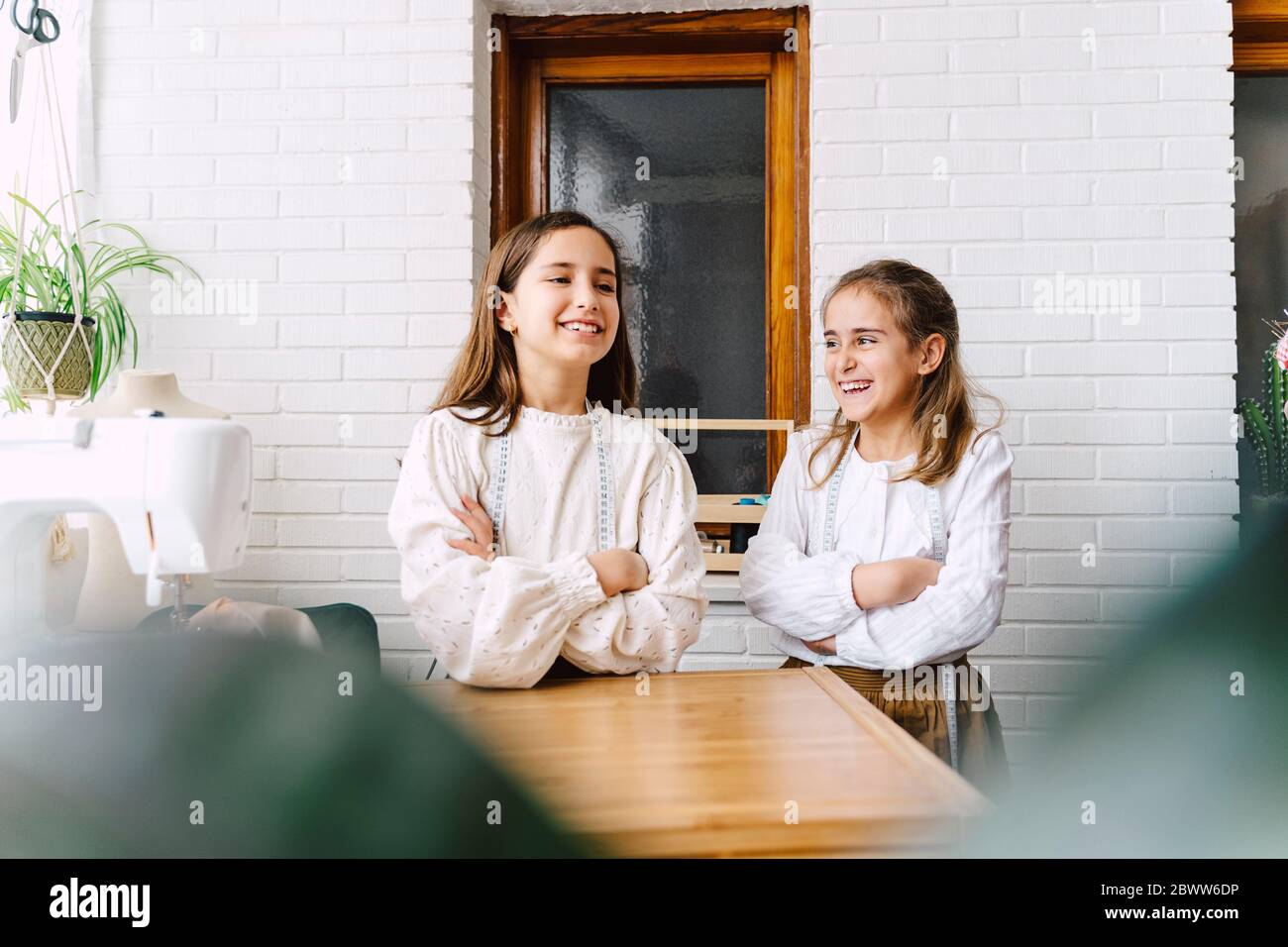 Girls together sewing hi-res stock photography and images - Alamy