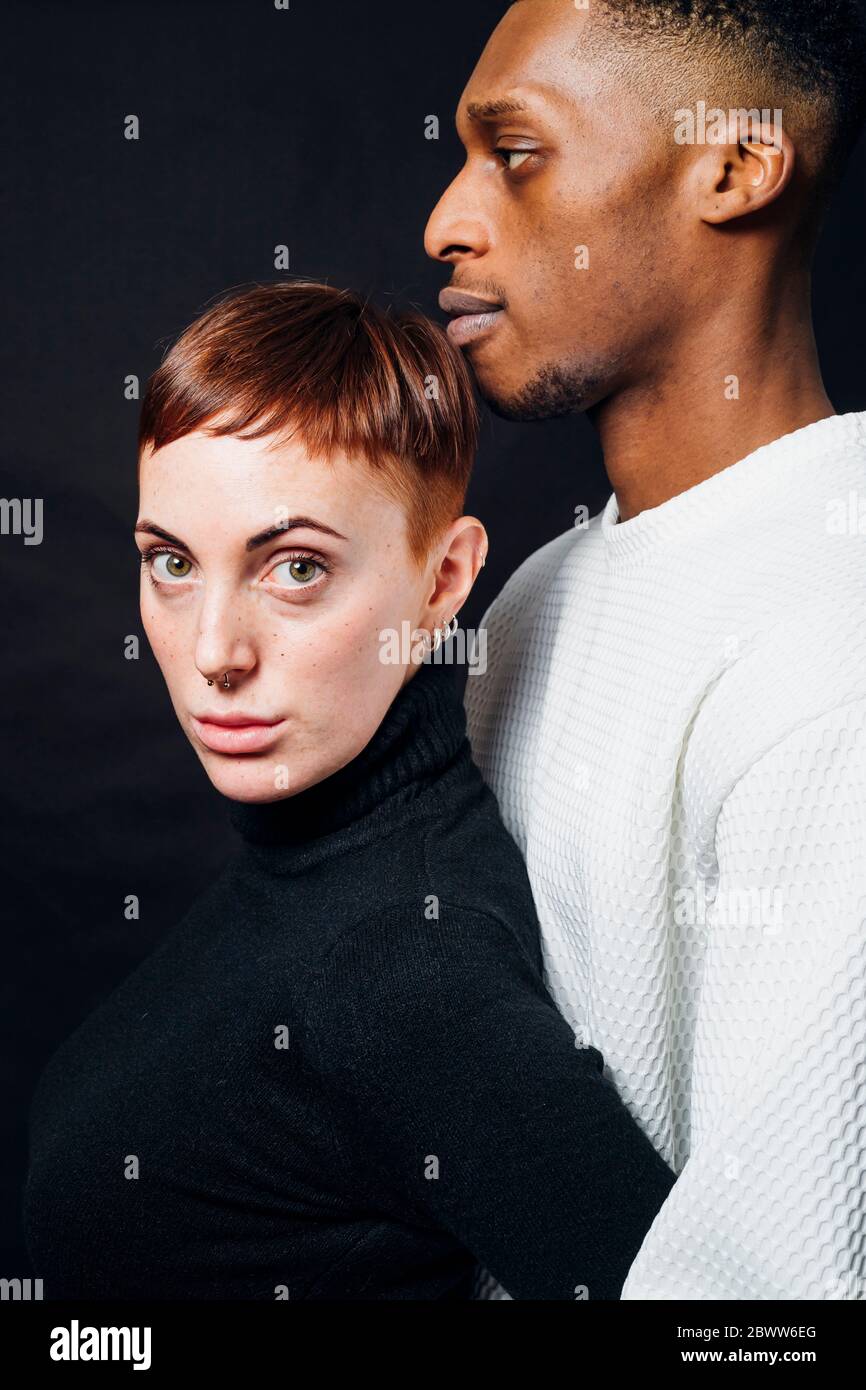 Studio portrait of mixed race couple Stock Photo - Alamy