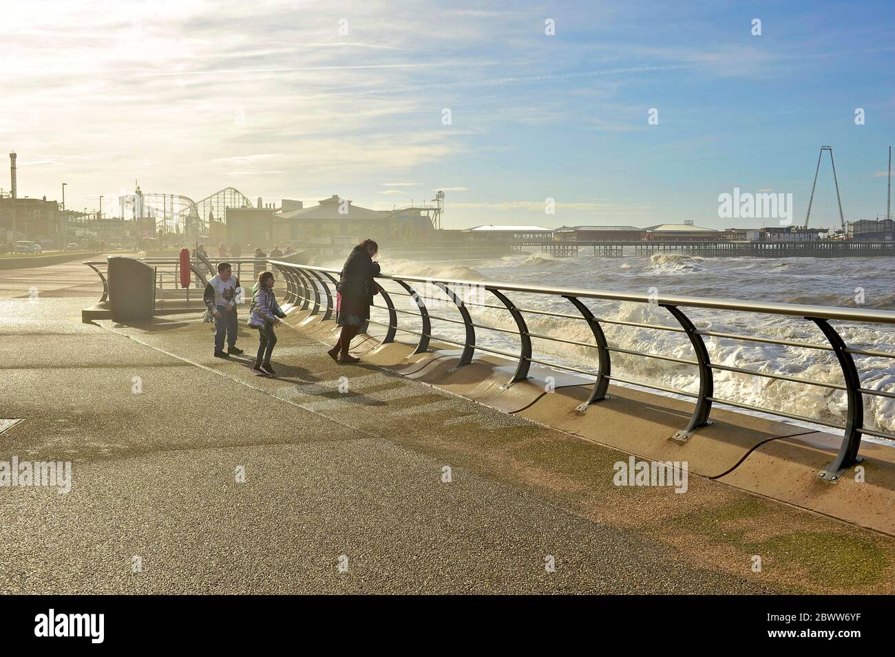 Children watching the tide come in hi-res stock photography and images ...