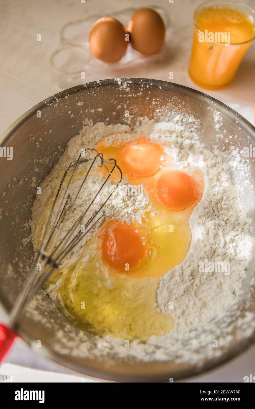 Cake ingredients in bowl Stock Photo - Alamy